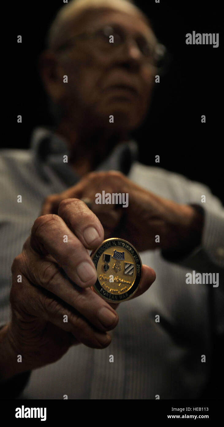 Clovis, N.M., veteran Dan McKinney, holds a coin awarded to him by the ...