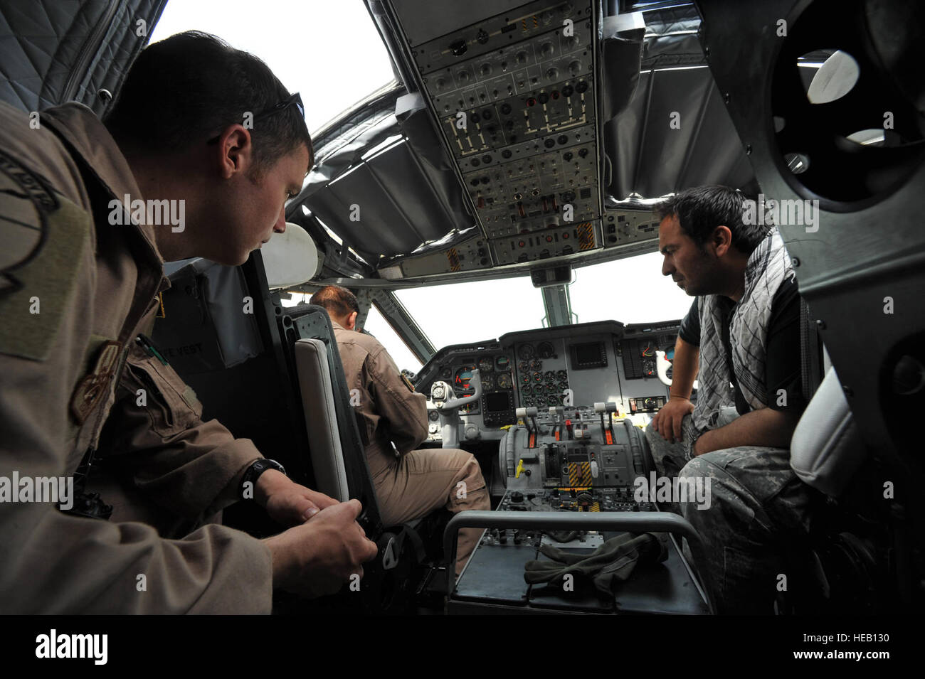 An Afghan Air Force loadmaster conducts pre-flight checks in a C-27 ...