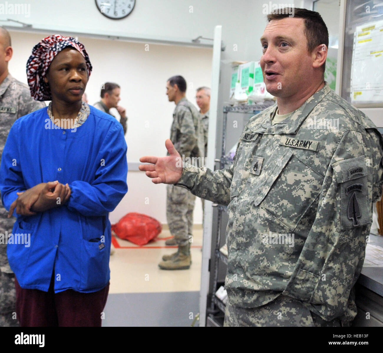 Army Staff Sgt. Brian Neuman, a member of Operation Proper Exit, talks ...