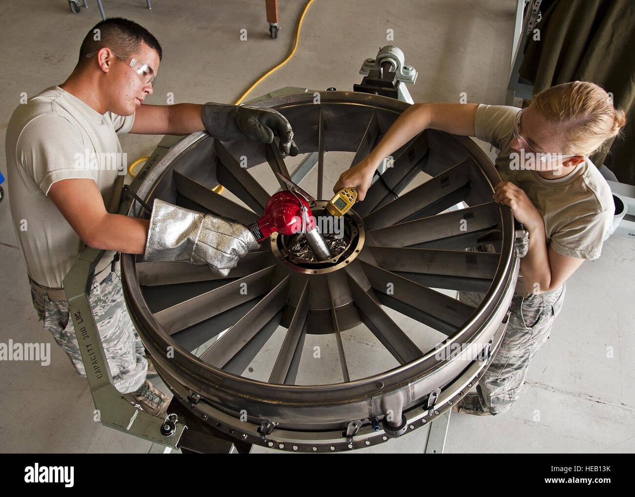 Airmen conduct maintenance on an F-110 engine from an F-15 Eagle at ...