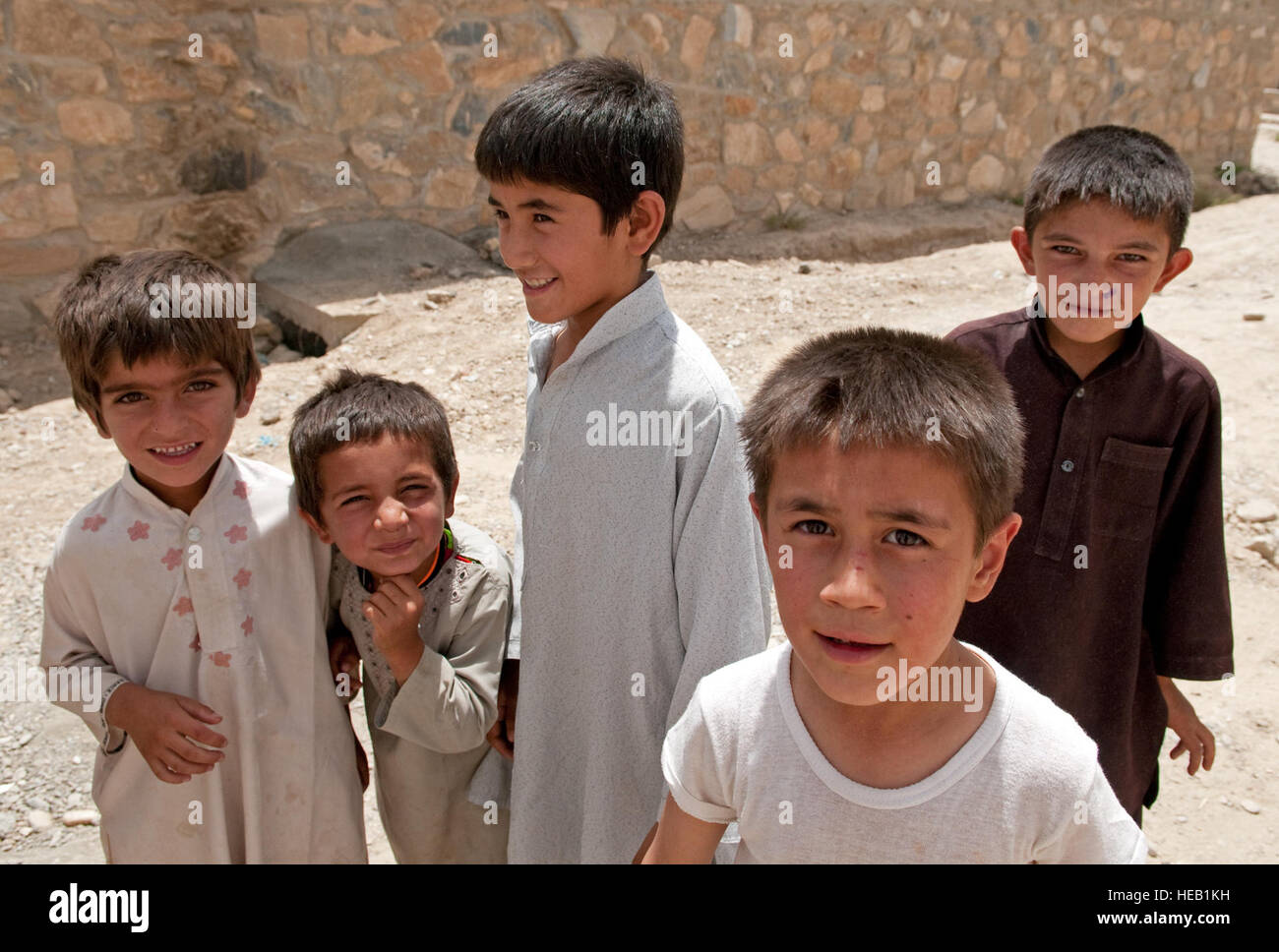 Young Afghan boys pose for the camera during a routine patrol by ...