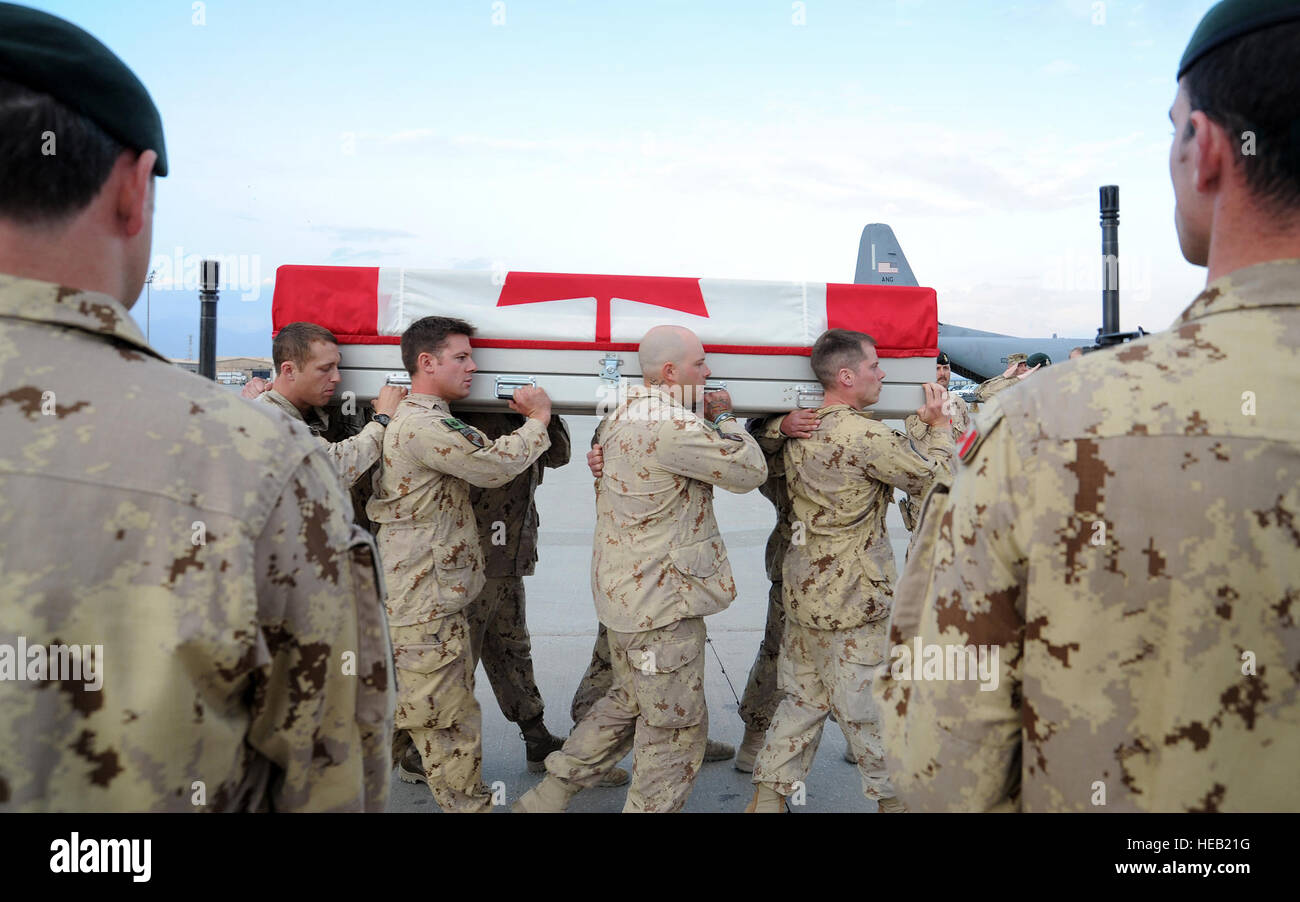 A cadre of Canadian service members carry the transfer case of Master ...