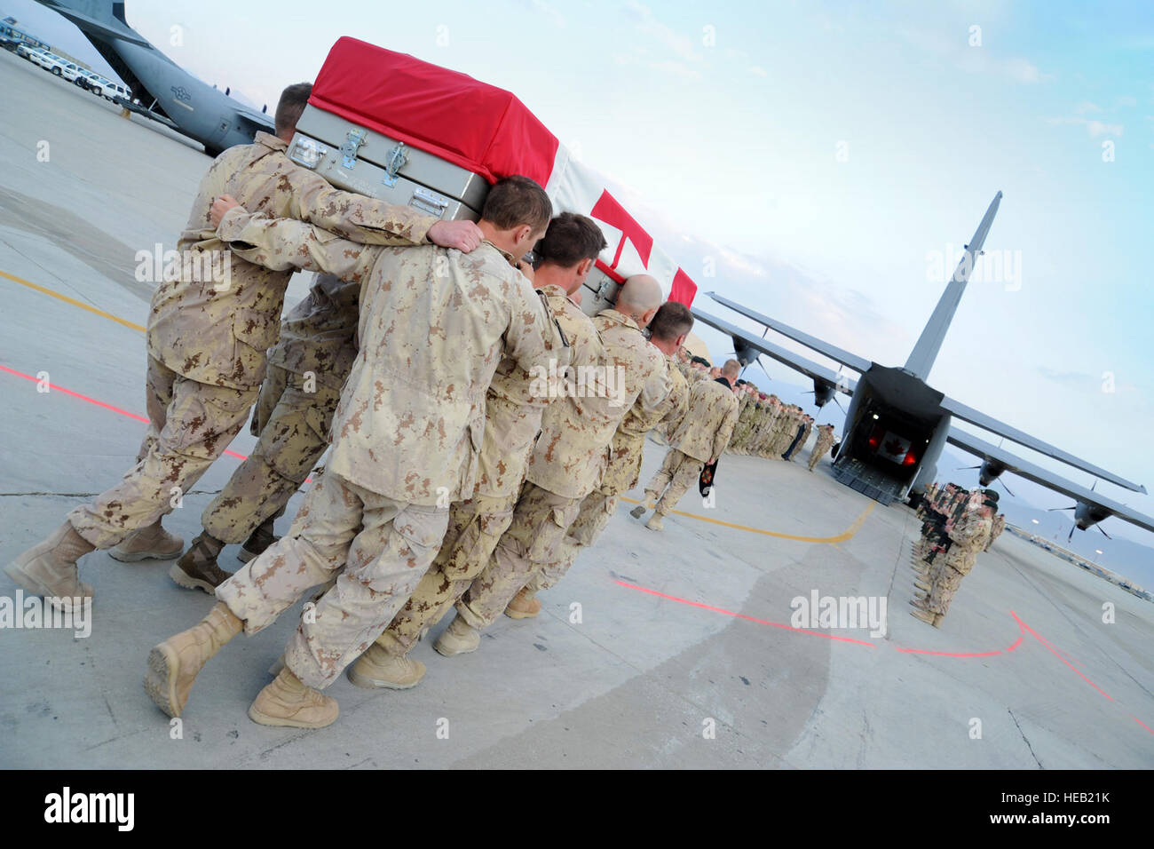 A cadre of Canadian service members carry the transfer case of Master ...
