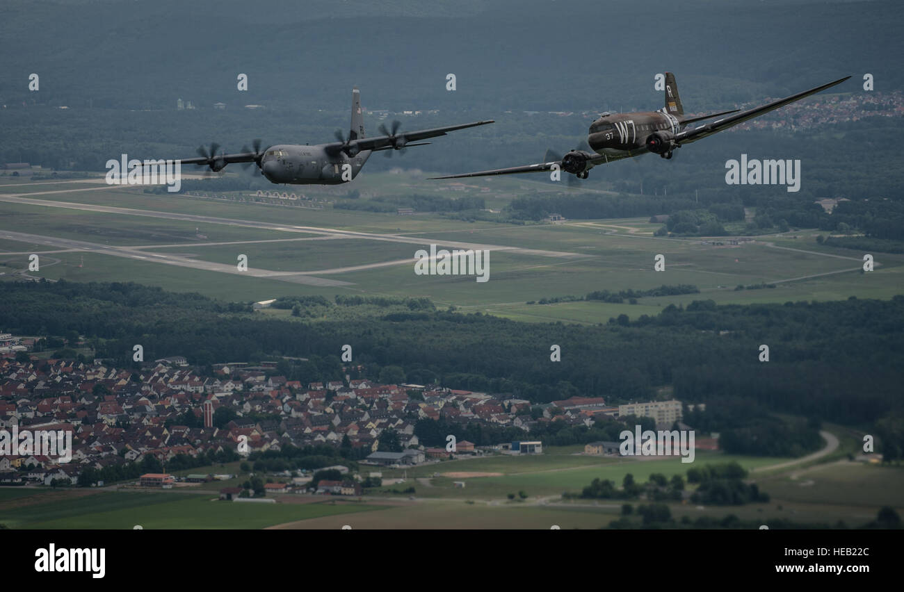 A Douglas C-47 Skytrain, known as Whiskey 7, flies alongside a C-130J ...