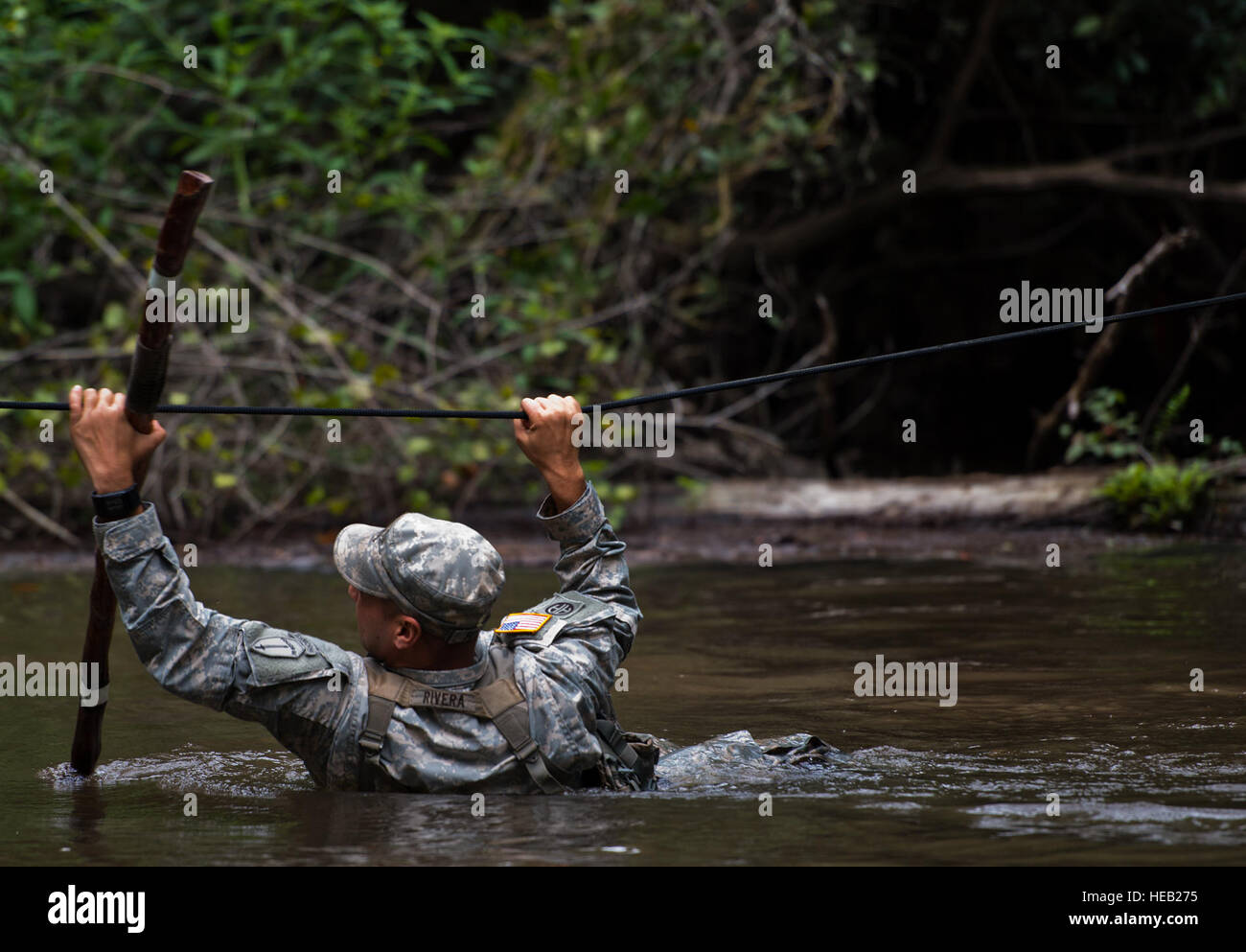 Staff Sgt. Ariel Rivera, 6th Ranger Training Battalion, crosses the ...