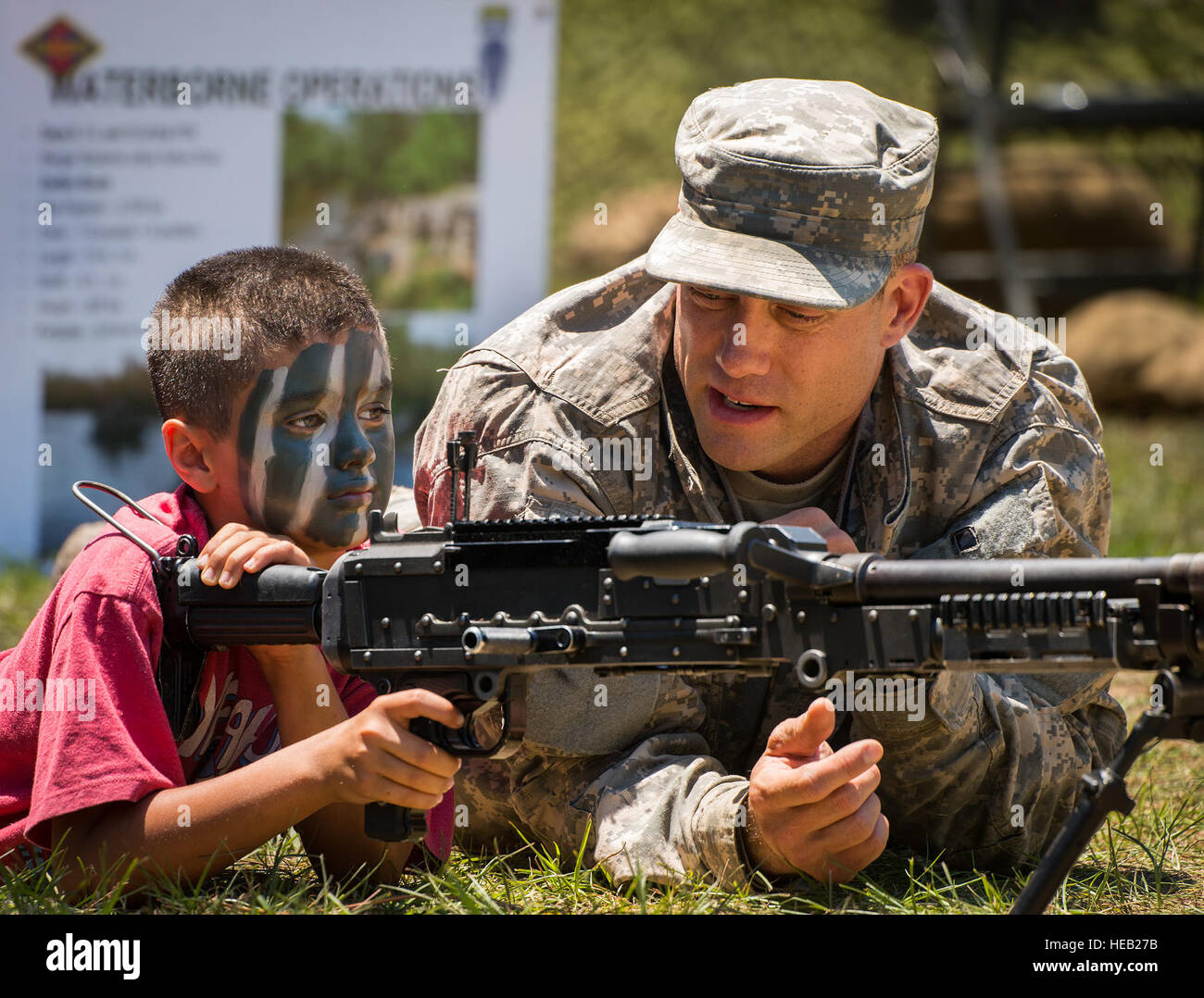 A Soldier talks with a “future Ranger” about a machine gun during the ...