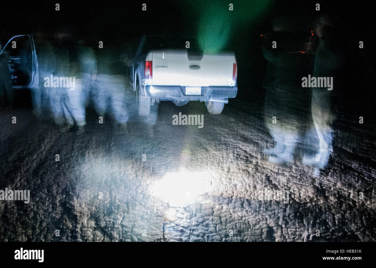 94th Airlift Wing personnel set lights on a dry lake bed near Nellis ...
