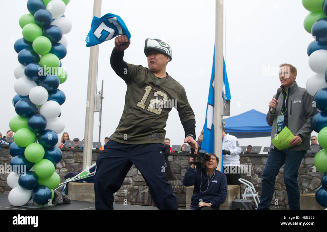 A local retired Army veteran and Seattle Seahawks fan shows a crowd of ...