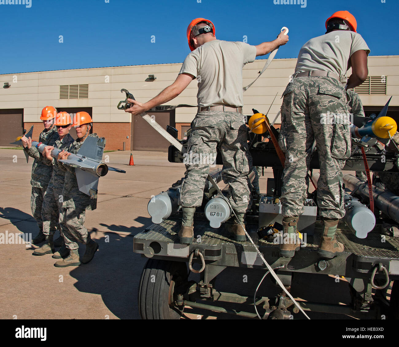 Airmen from the 363rd Training Squadron complete loading, tying down ...