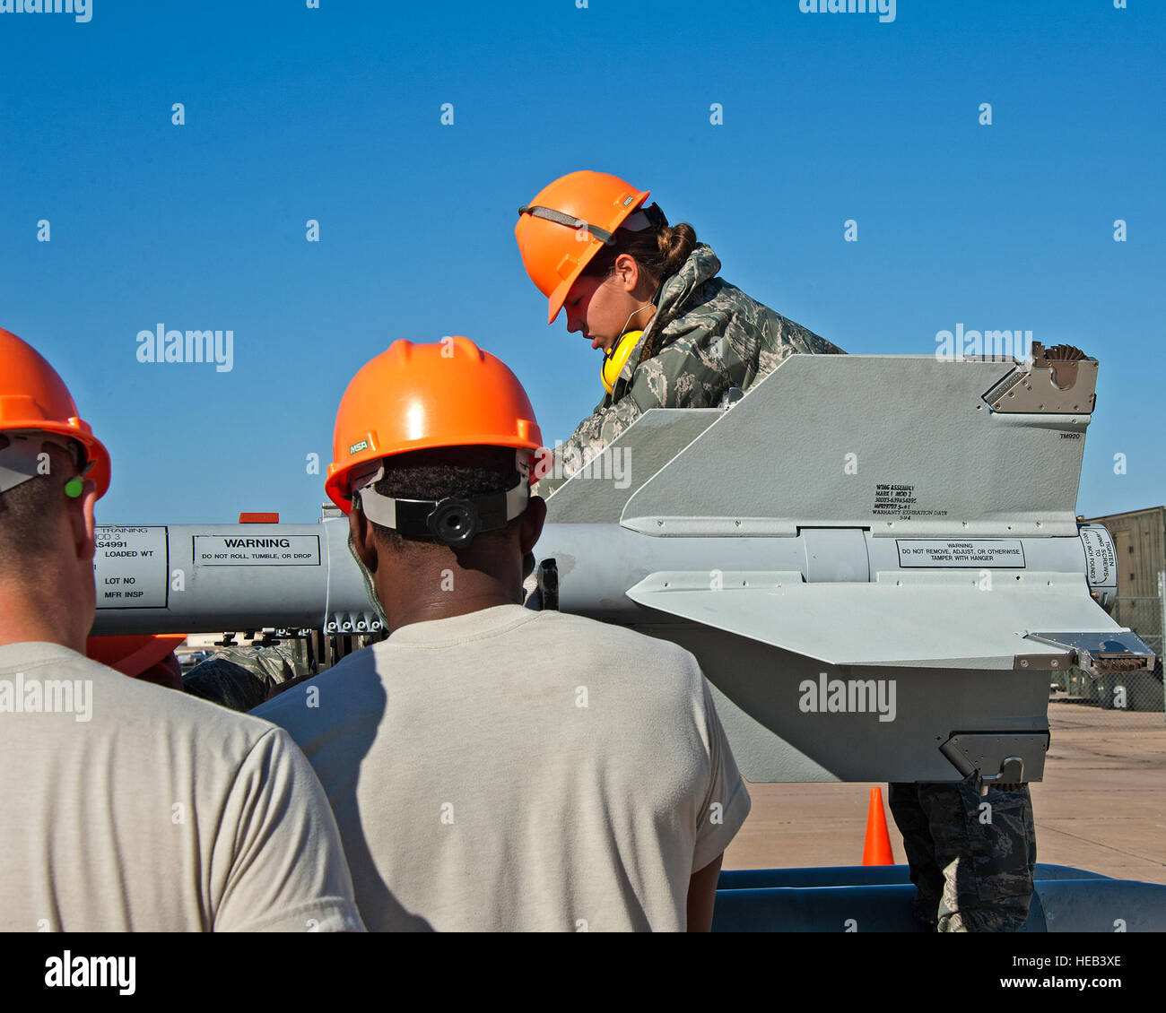 Airmen from the 363rd Training Squadron secure AIM-9M munitions to MHU ...