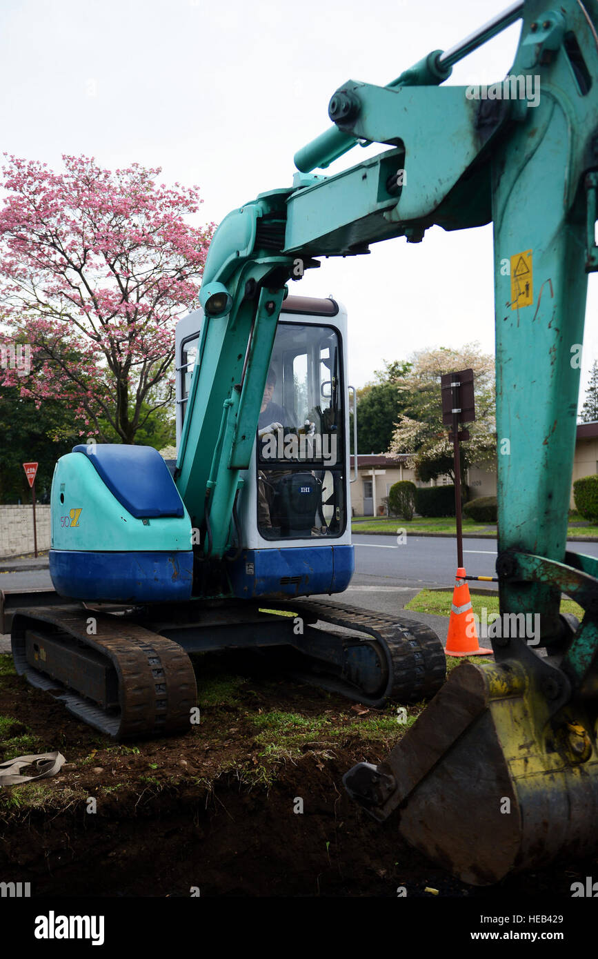 A Japanese civilian operates an excavator April 21, 2015 at Yokota Air ...