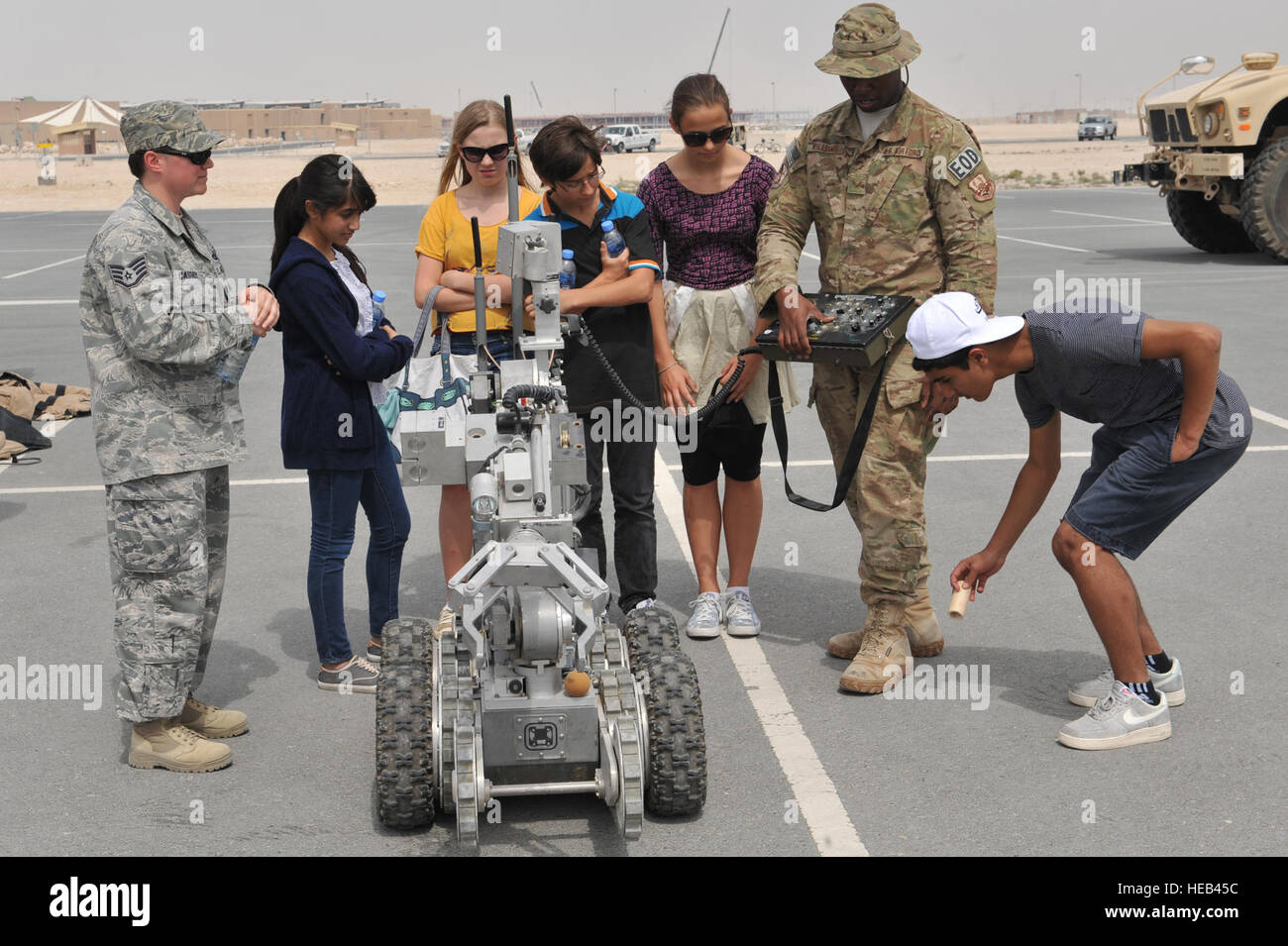 Senior Airman Joel Williams (right) demonstrates the use of a Remotec ...
