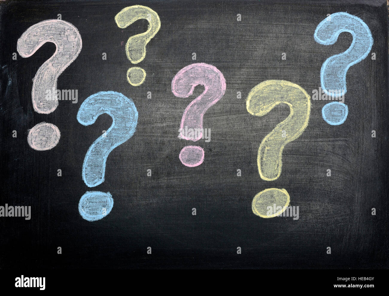 Question mark icons handwriting on the chalkboard Stock Photo - Alamy