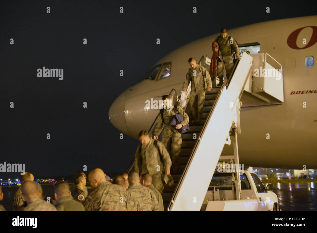 Airmen from the 90th Fighter Squadron and 3rd Maintenance Group depart ...