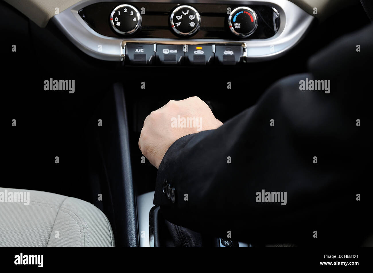 Business man hand on automatic gear shift knob Stock Photo - Alamy