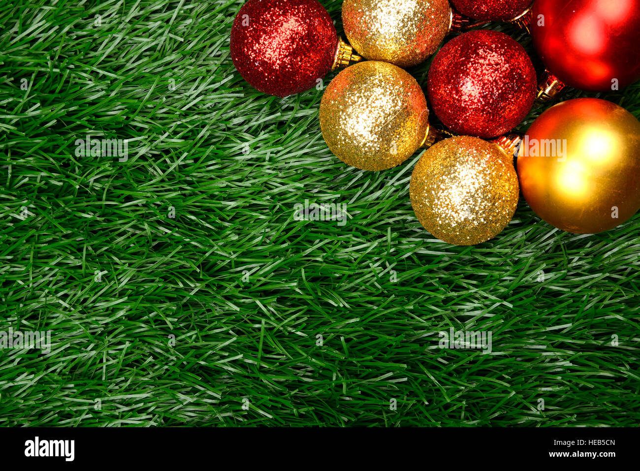 Christmas ornament on the green grass background. Chrismas background ...