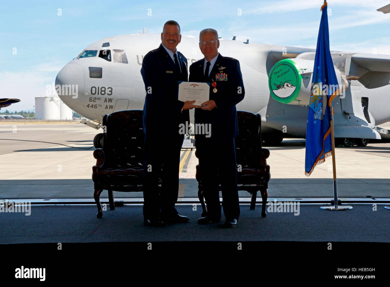 Maj. Gen. Mark A. Kyle pins a Legion of Merit medal on retired Col ...