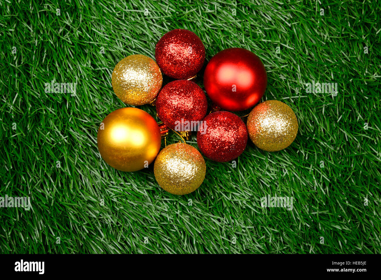 Christmas ornament on the green grass background. Chrismas background ...