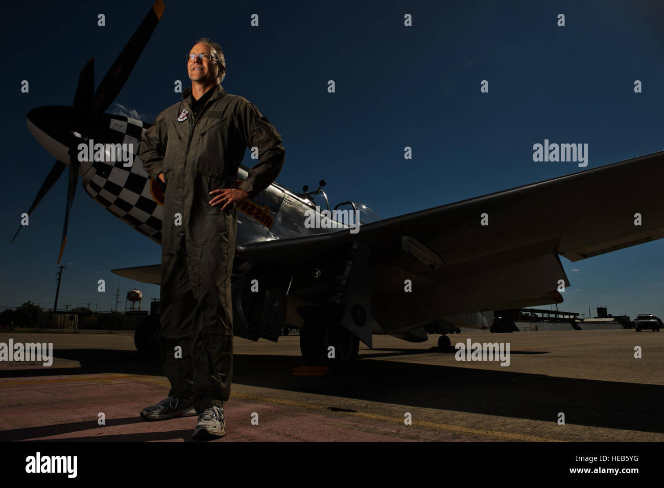 Robert Garriott, P-51 Mustang pilot, stands next to his P-51 after ...