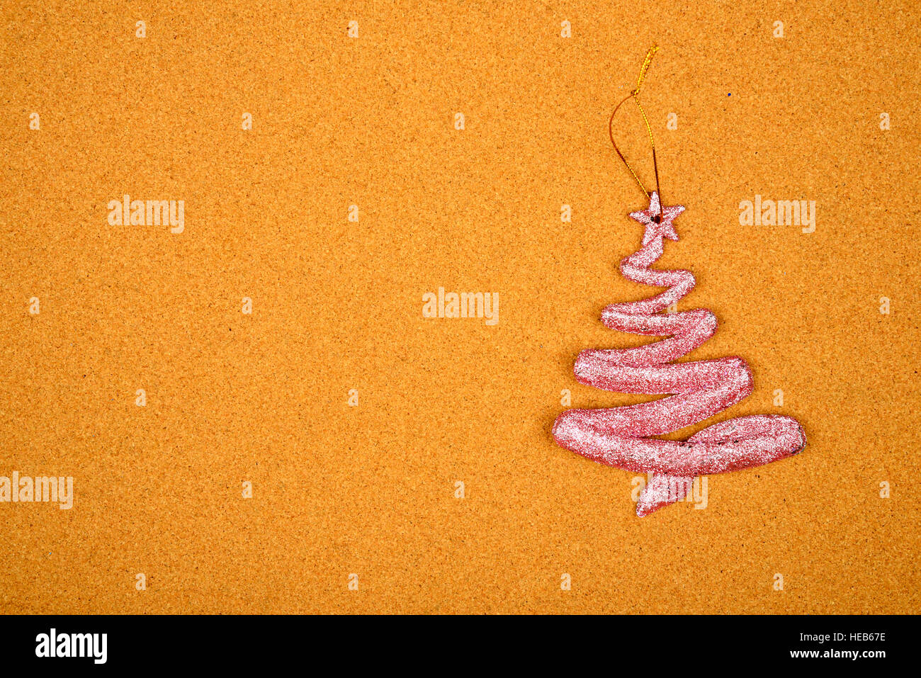 Christmas ornament on brown background. You can put your message in ...