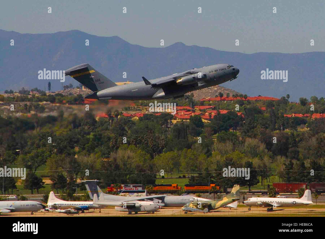 A C-17 from Hawaii takes off with March Field hostoric aircraft in the ...