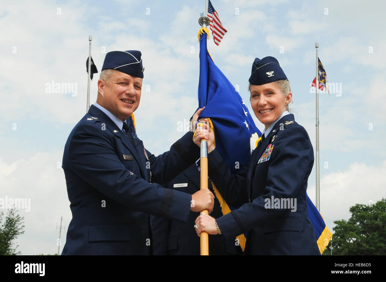U.S. Air Force Maj. Gen. Lawrence Wells passes the guidon to Col ...
