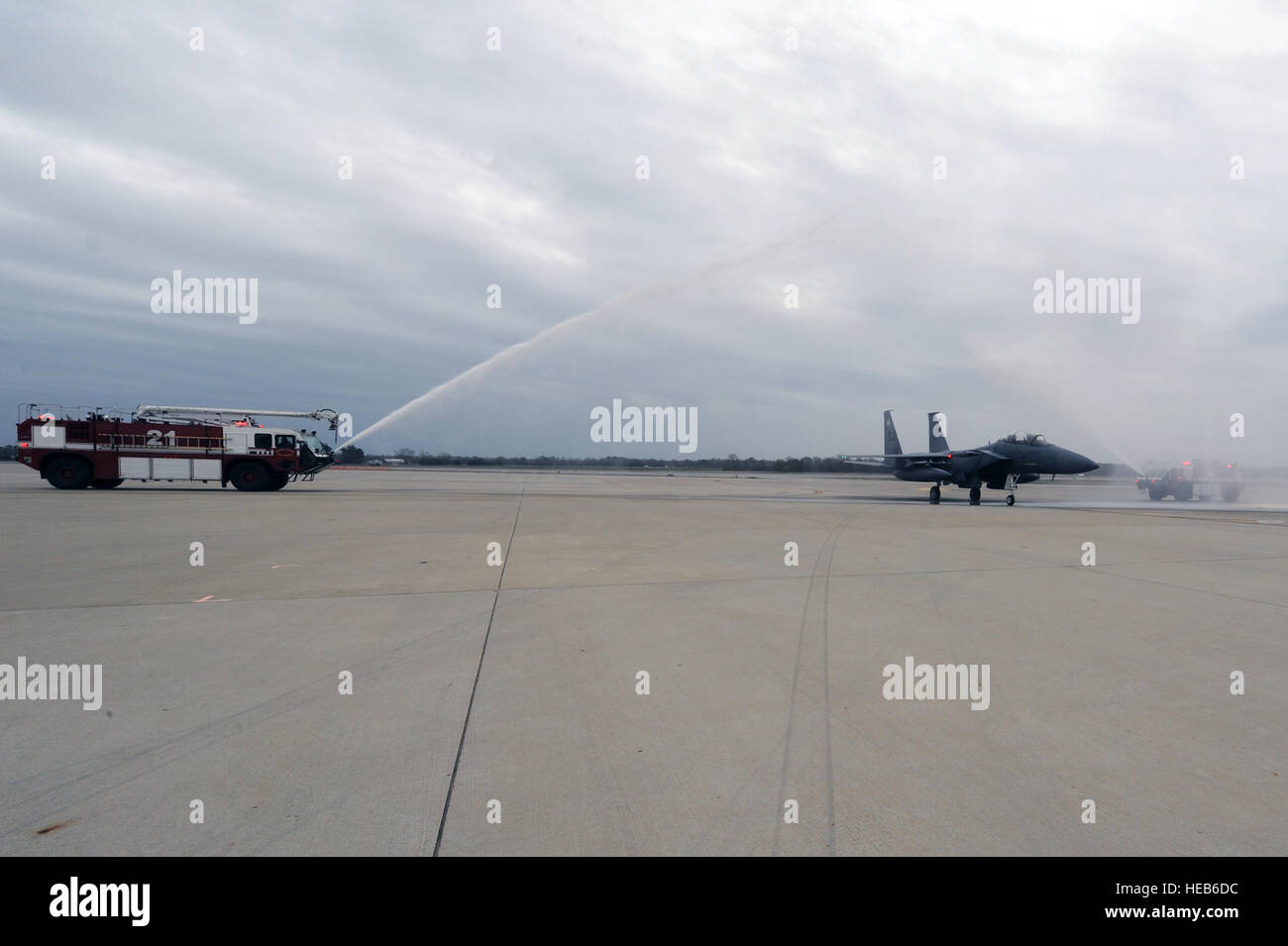 U.S. Air Force Col. Vann Green taxis under a water arc after completing ...