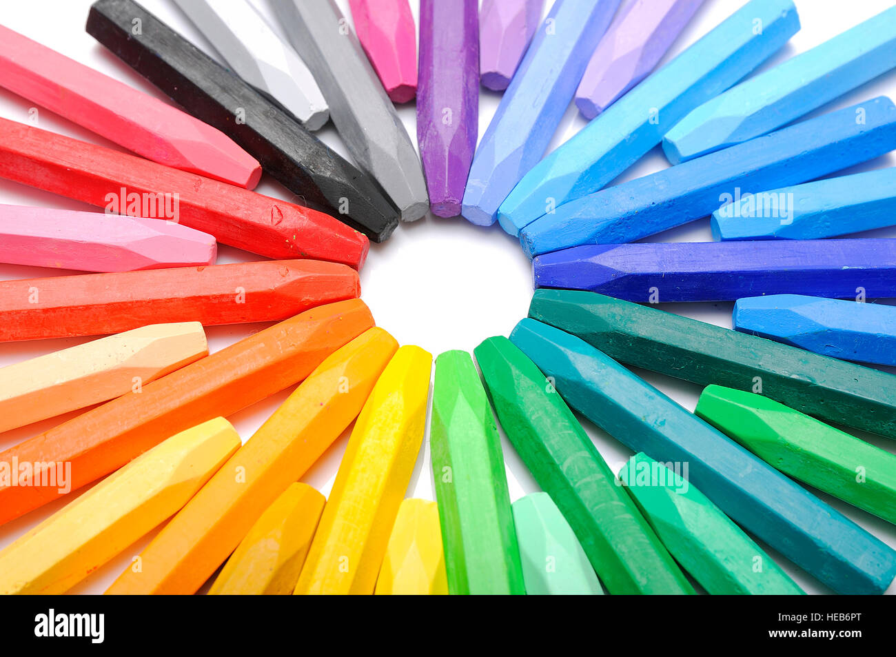 Row of colorful crayon making circle shape over white background Stock ...