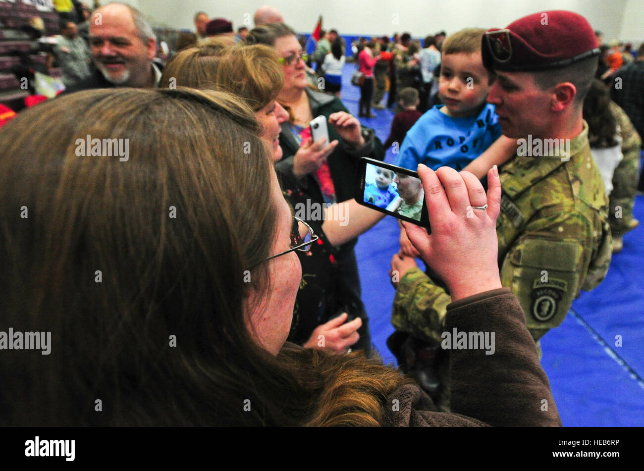 Lisa Musick, left, takes video with her cellphone of Sgt. James ...