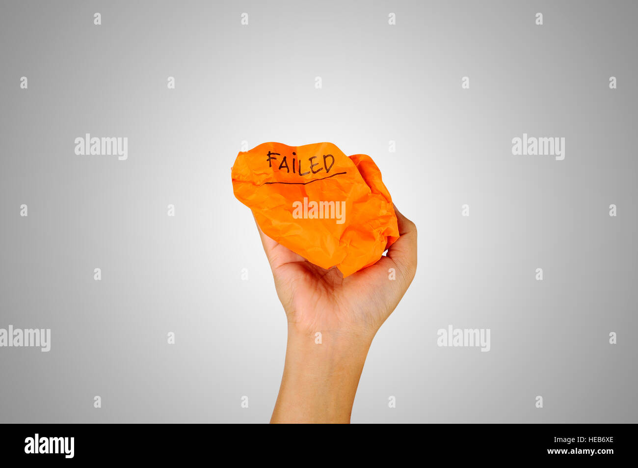 Failed Concept. Human hand holding crumpled paper with failed writing ...