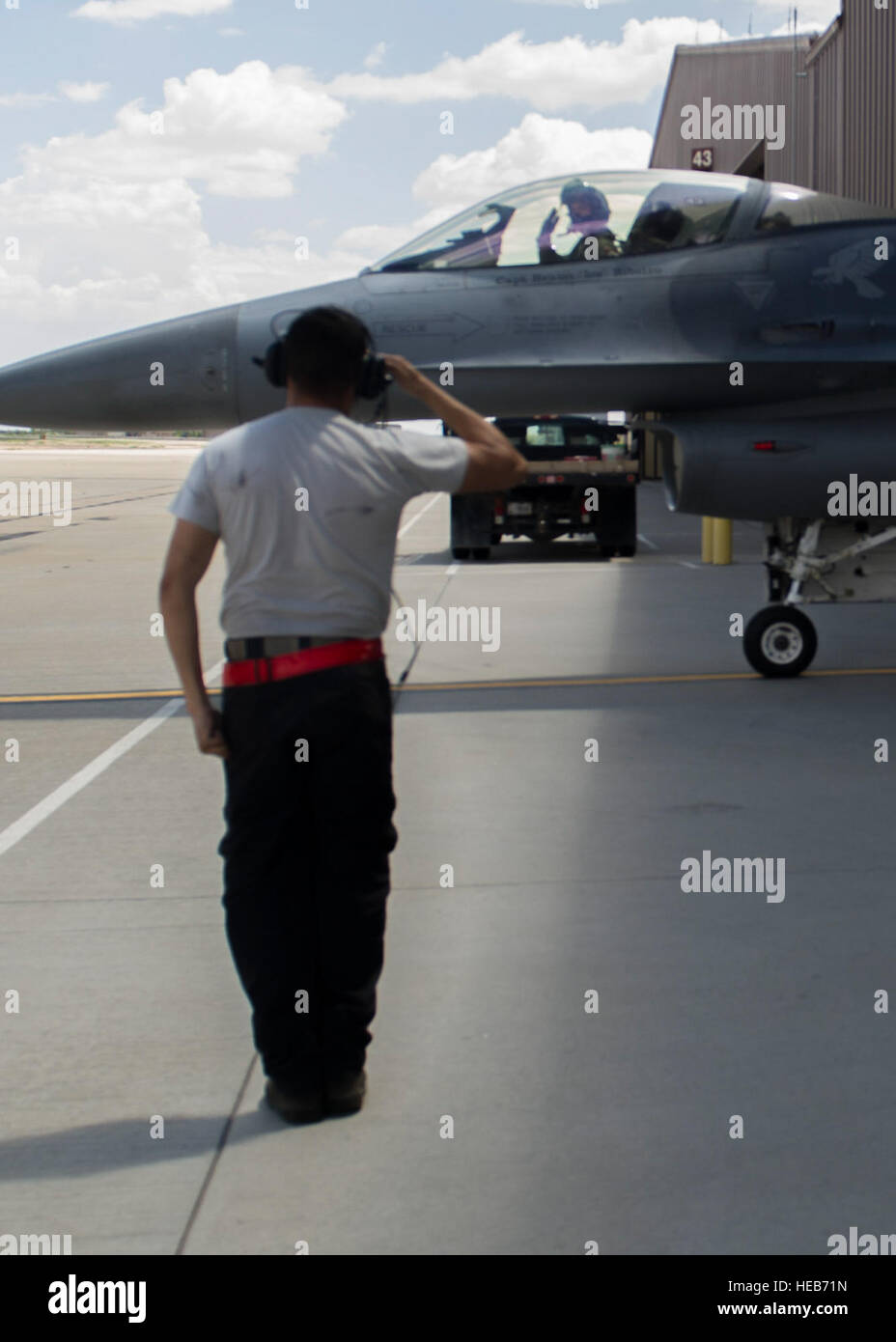 Senior Airman Ramiro Gamero, 311th Fighter Squadron crew chief, salutes ...