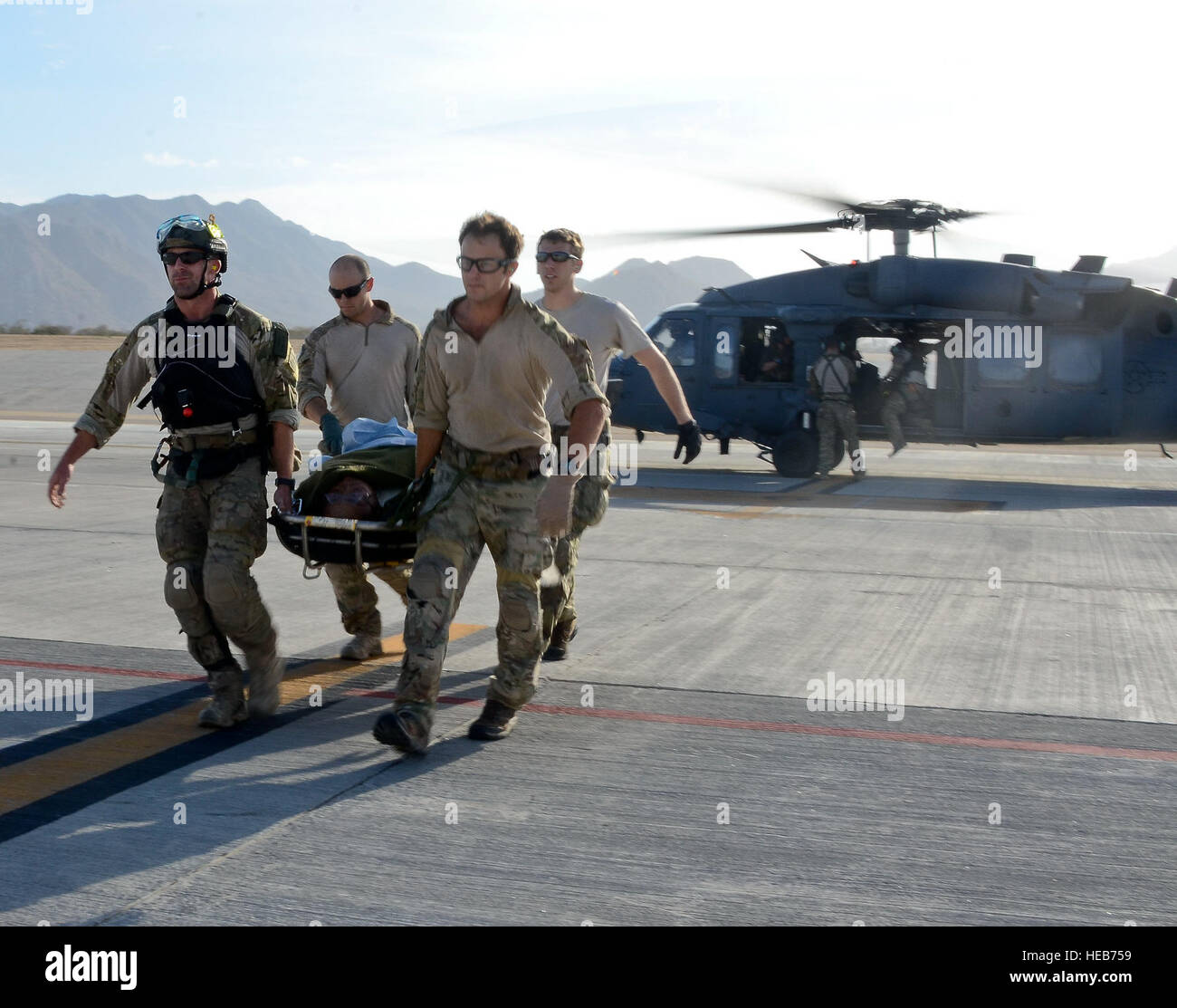 Pararescuemen from the 48th Rescue Squadron off-load patients from a ...