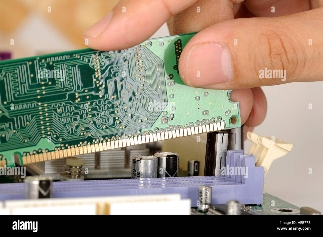 Man hand install memory card board on the computer motherboard Stock ...