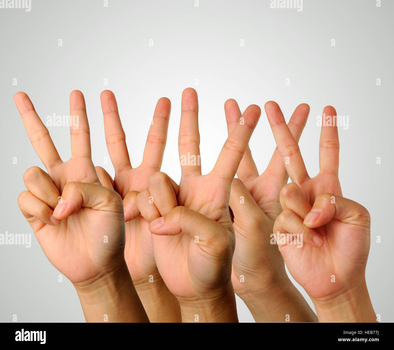 Hands showing the sign of victory and peace closeup Stock Photo - Alamy