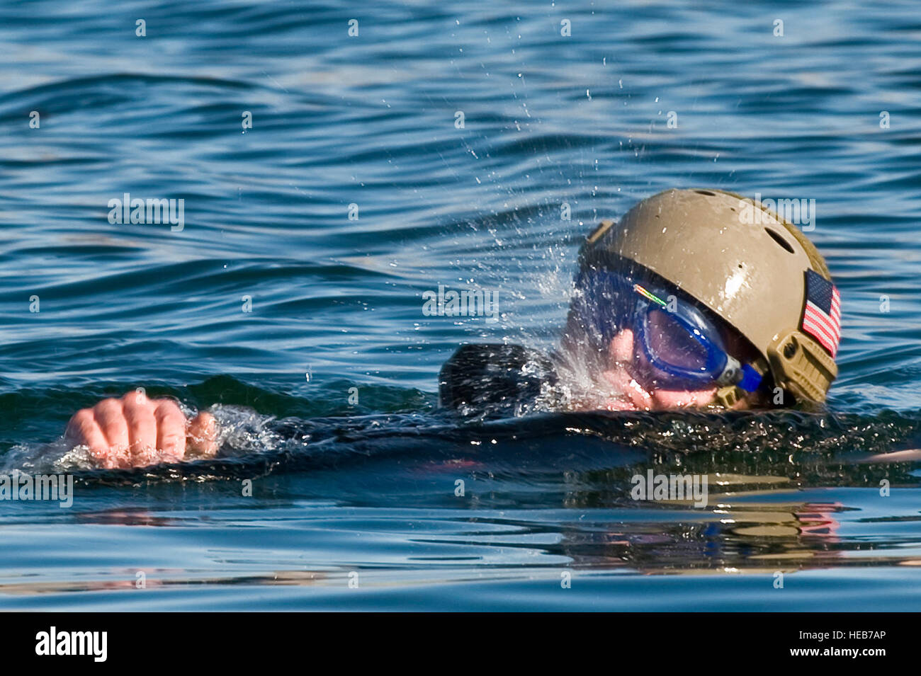 A U.S. Air Force pararescueman, 58th Rescue Squadron, swims toward a ...
