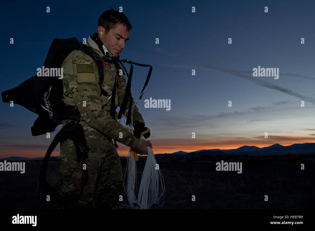A U.S. Air Force pararescueman, 58th Rescue Squadron, untangles his ...