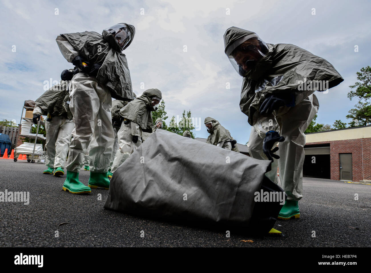 Airmen from the 628th Medical Group, unravel the floor of a ...