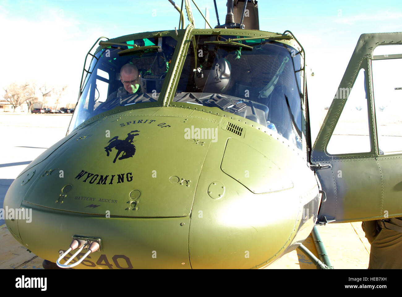 A 37th Helicopter Squadron pilot conducts preflight checks on a ...
