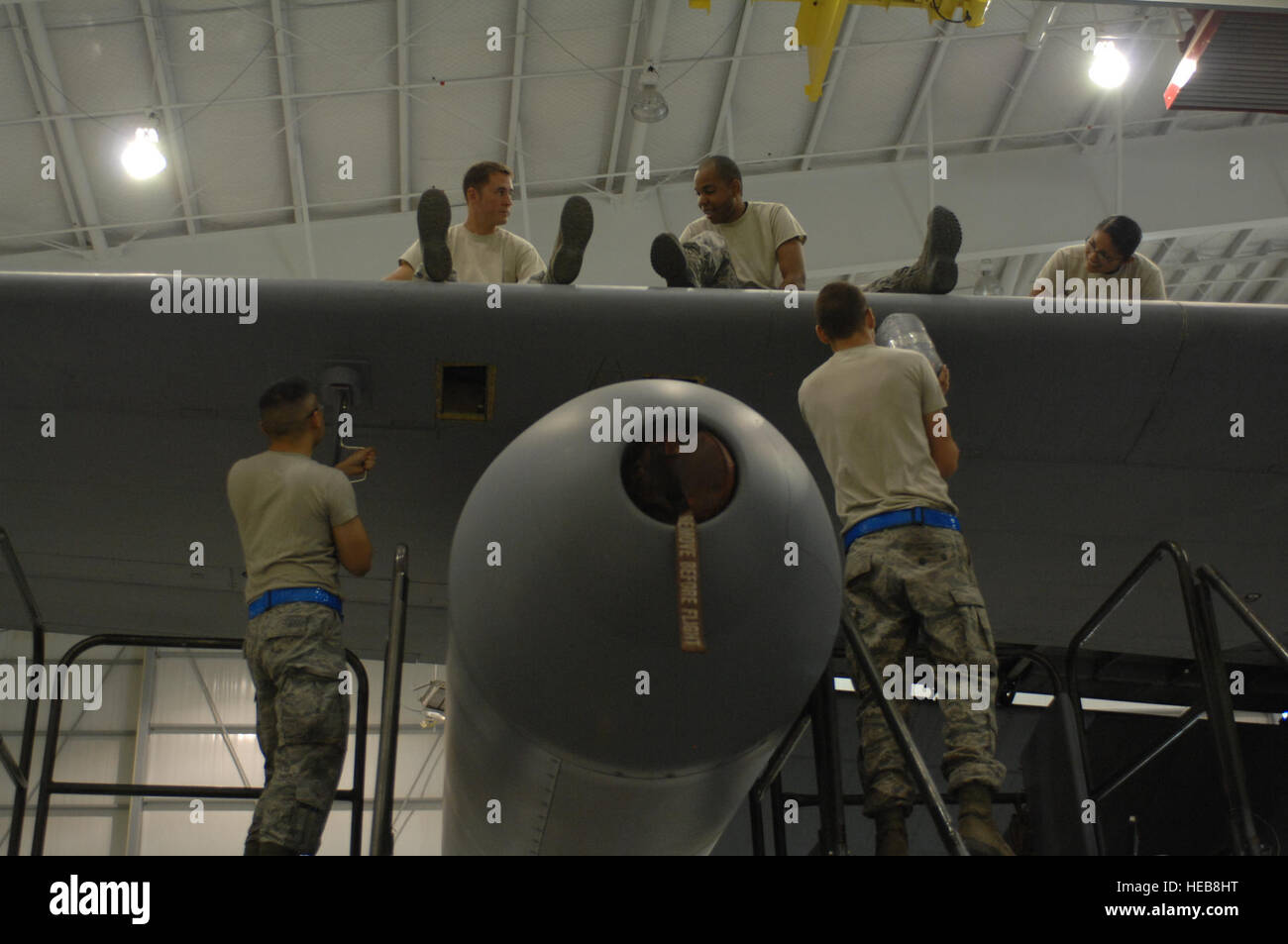 Airmen from the 755th Aircraft Maintenance Squadron re-attach the ...
