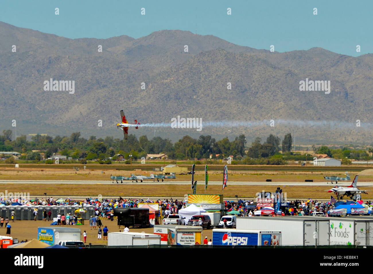 The Red Bull demonstration team performs aerial maneuvers for the crowd ...