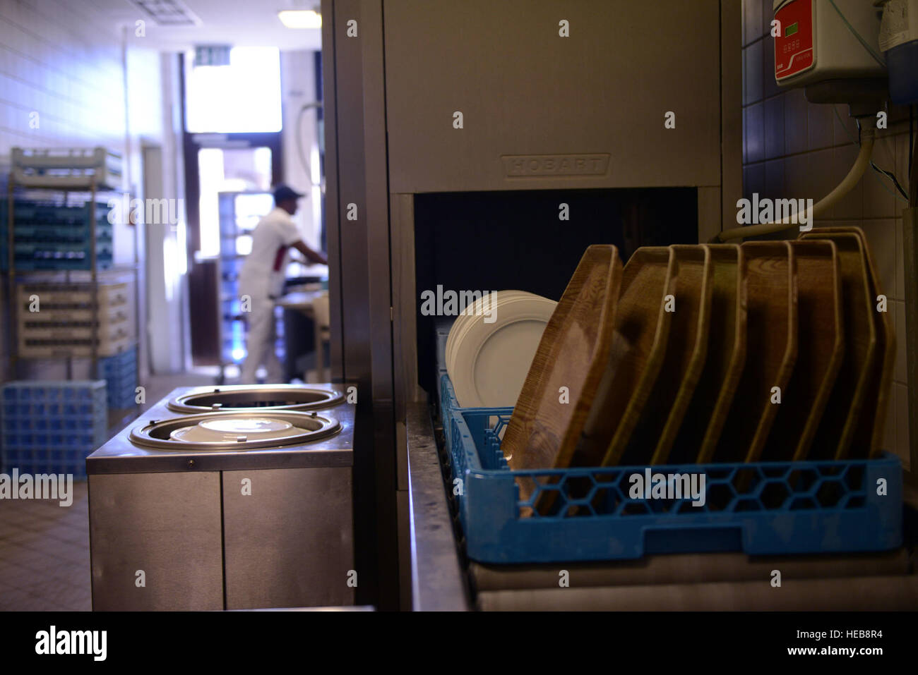 Newly washed dishes roll out of a dish washer at the Rheinland Inn ...