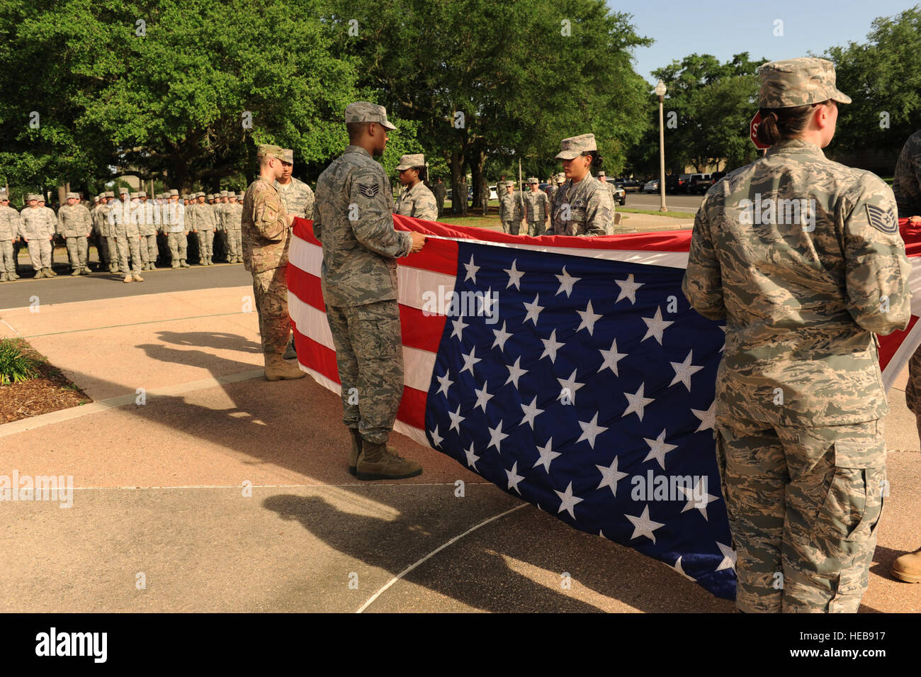 Members of the 334th Training Squadron fold the U.S. flag during the ...