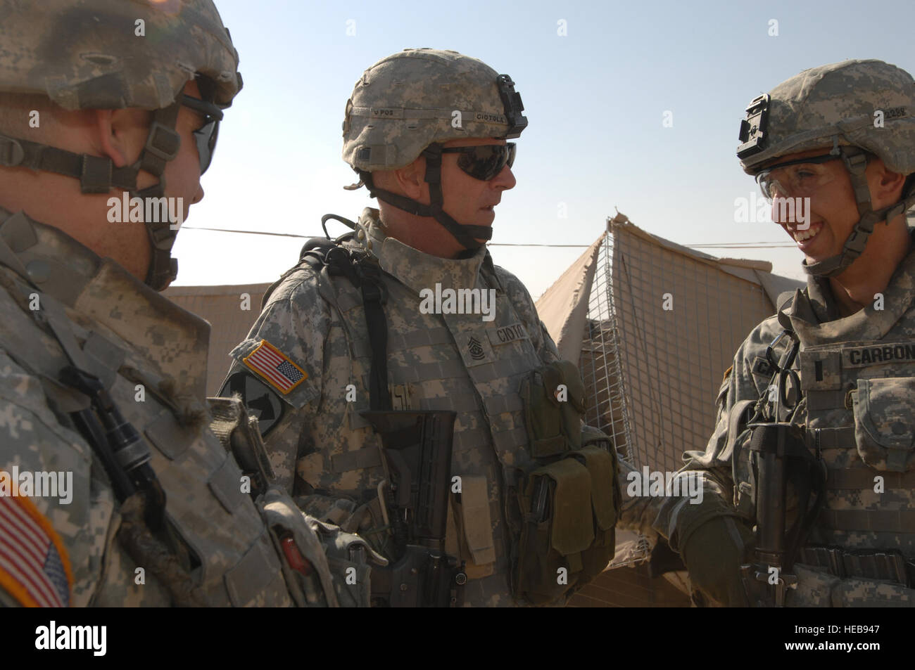 Command Sgt. Maj. Neil Ciotola of Multi-National Corps-Iraq, center ...