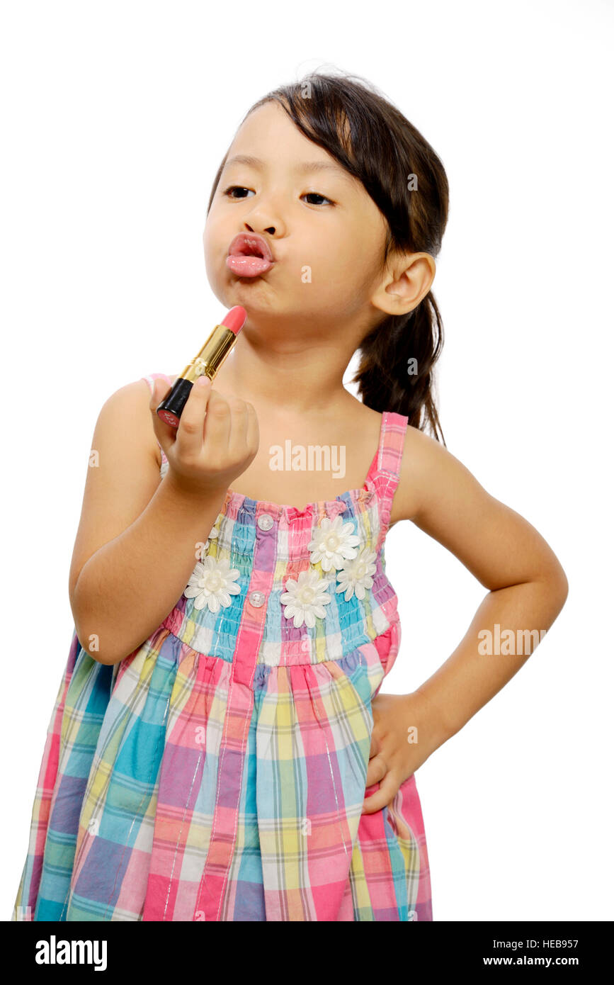 Portrait of pretty little girl with makeup isolated on white background ...
