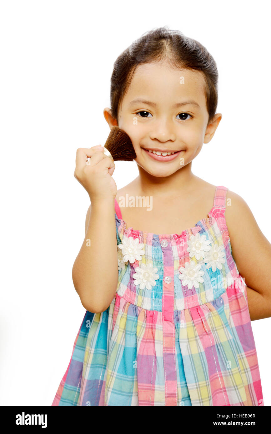 Portrait of pretty little girl with makeup isolated on white background ...