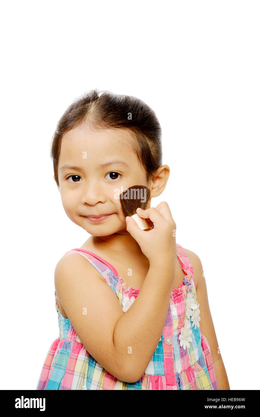 Portrait of pretty little girl with makeup isolated on white background ...