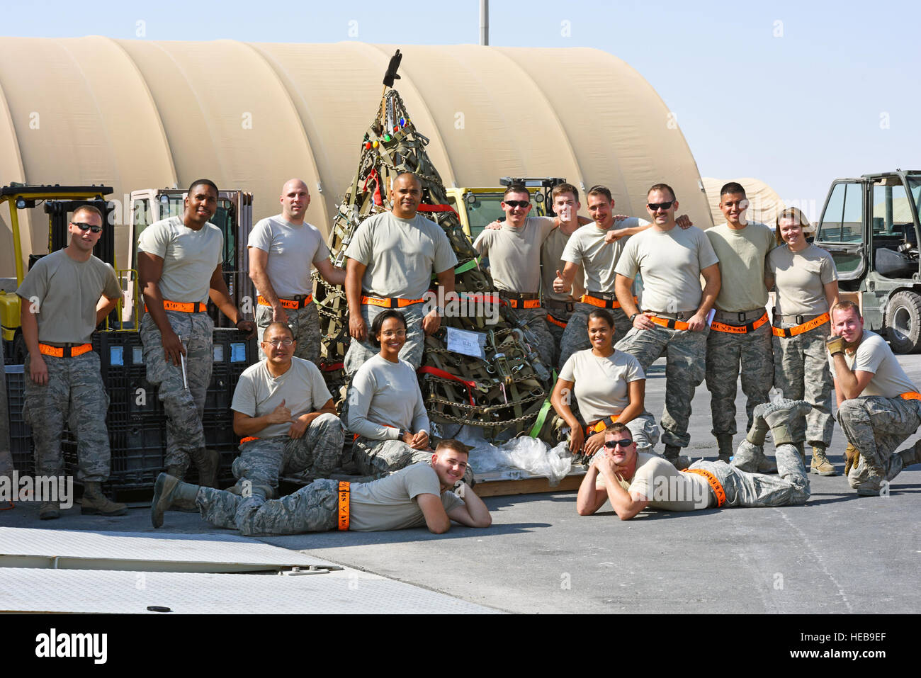 Airmen with the 8th Expeditionary Air Mobility Squadron pose in front ...