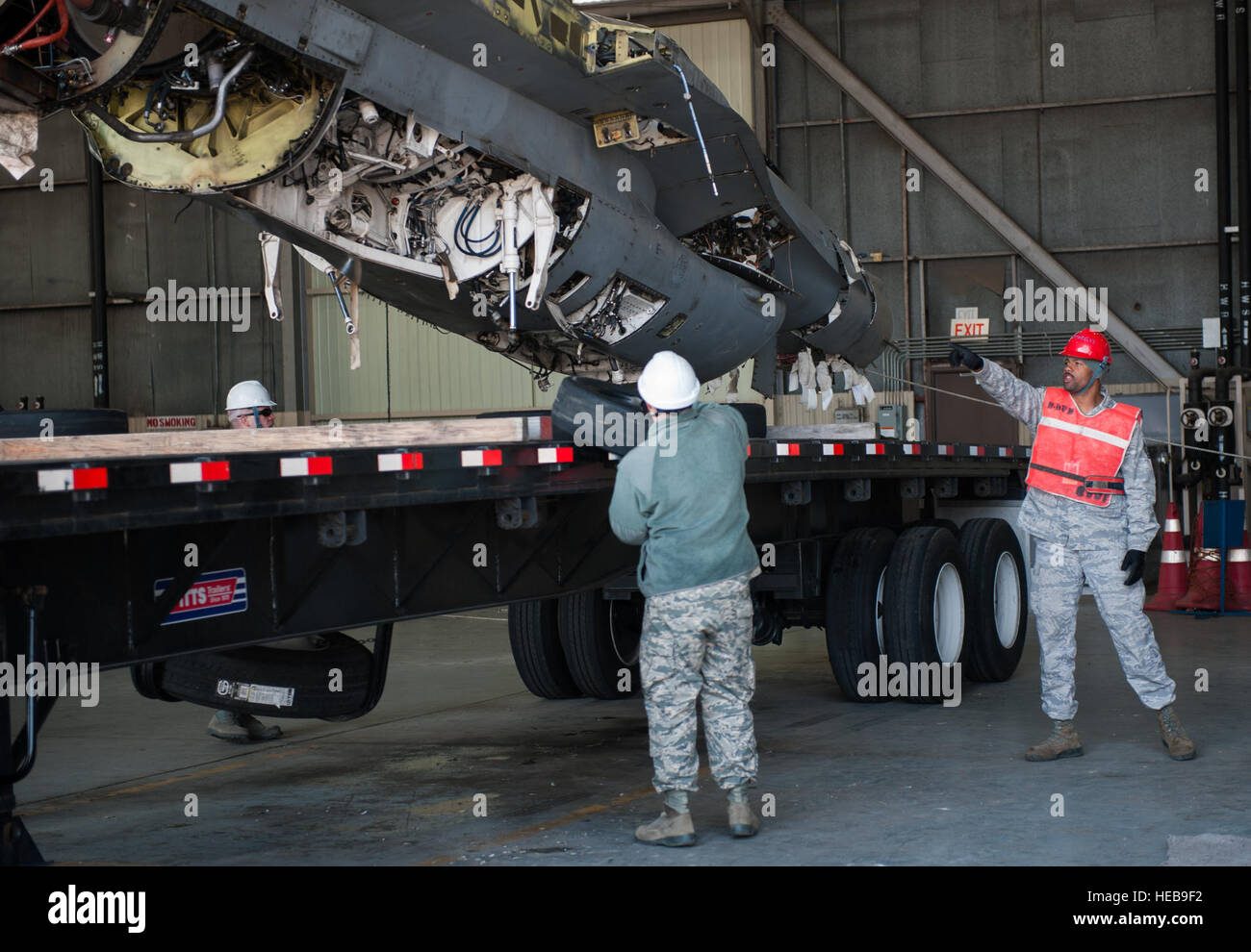 Airmen from the 8th Maintenance Squadron guide a damaged F-16 onto a ...