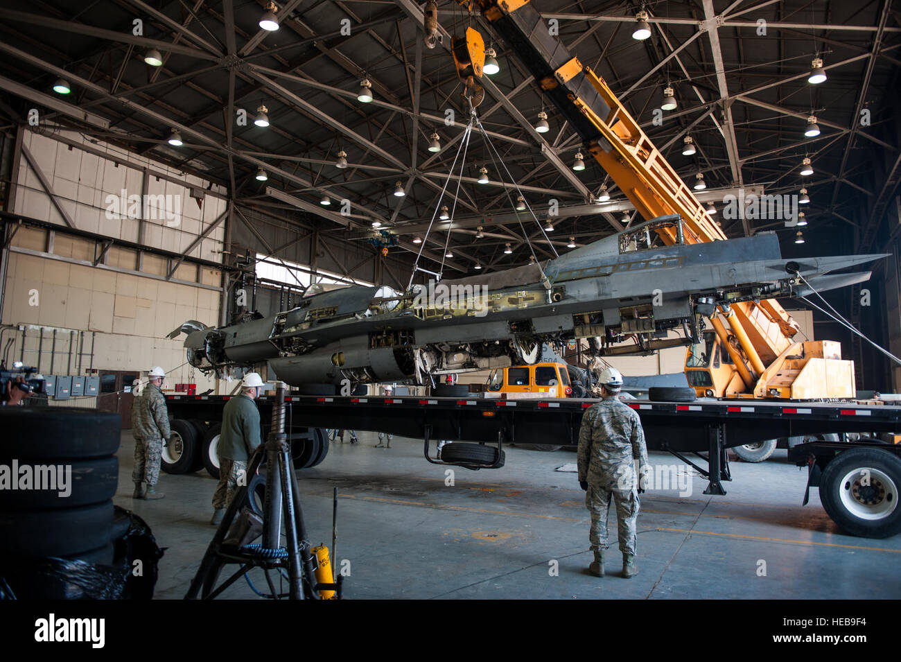 Airmen from the 8th Maintenance Squadron guide a damaged F-16 onto a ...