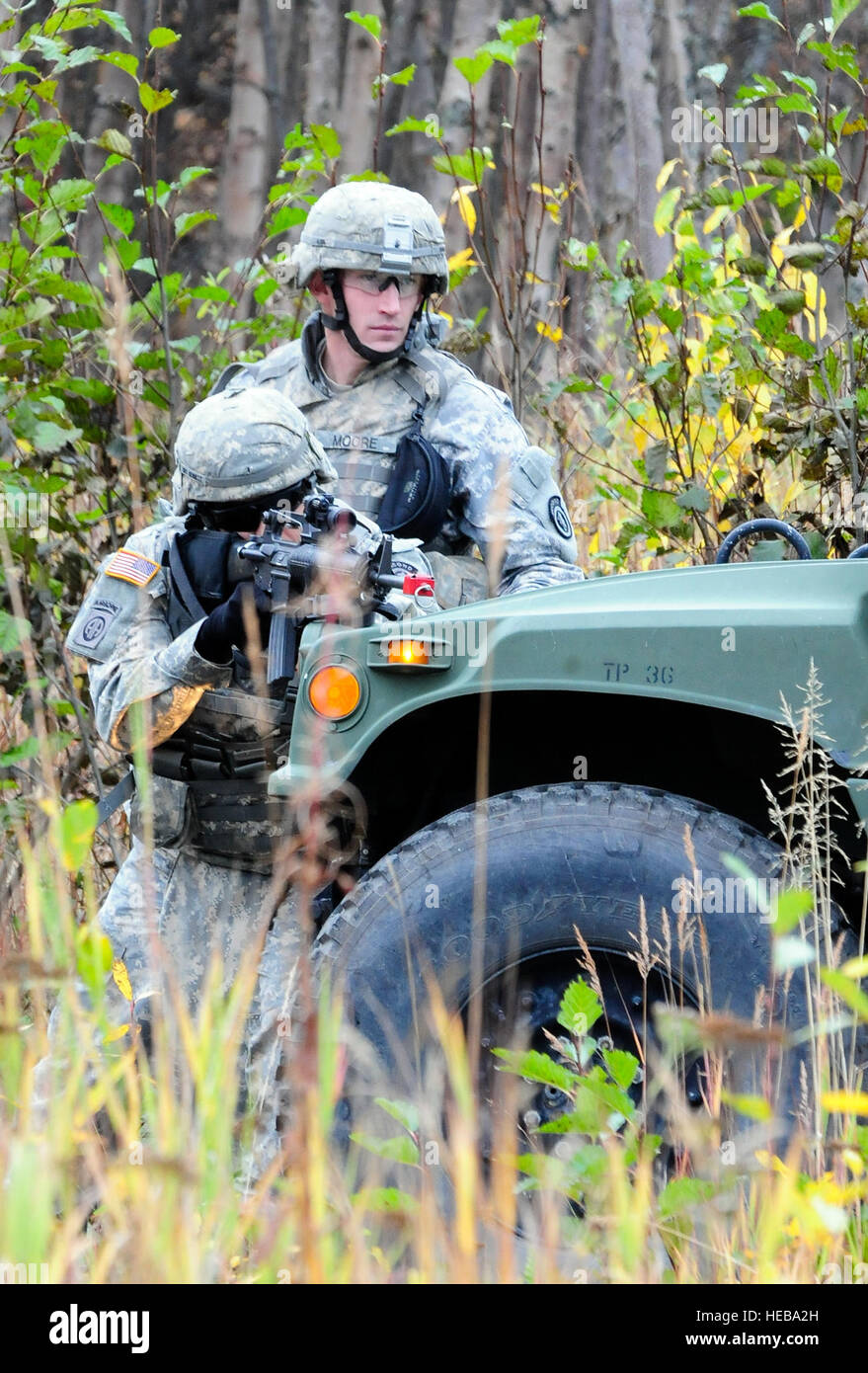 Staff Sgt. Jason Moore (standing), and Spc. Joseph Bennett, of Fontana ...